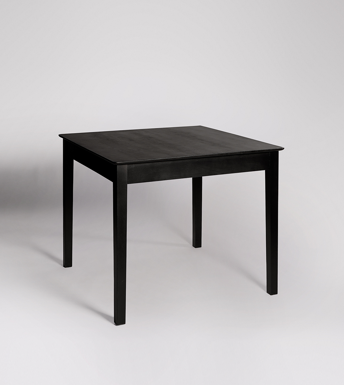Duval Classic Four-seater Dining Table in Black Mango Wood | Swoon